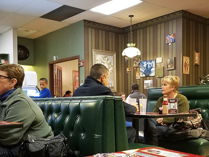 Step inside to discover a dining room that feels like your stylish grandmother's kitchen – mint green walls, twinkling lights, and cozy charm galore.