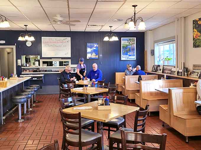 Inside Suomi, wooden booths and simple tables create an unpretentious atmosphere where conversations flow as freely as the coffee.