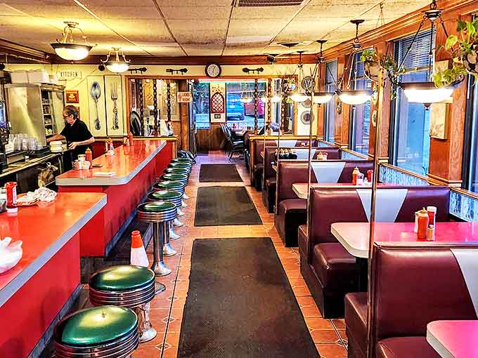 Step inside to classic Americana: red countertops, cozy booths, and the kind of atmosphere where coffee refills and friendly conversation flow freely.