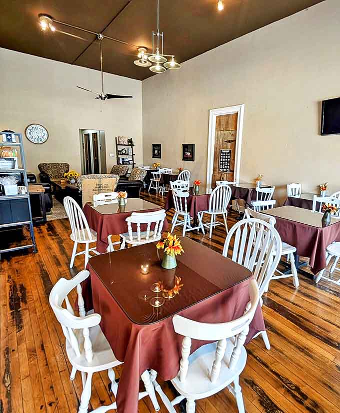 Burgundy tablecloths and white chairs create a homey atmosphere where time slows down and conversations flow as smoothly as their espresso.