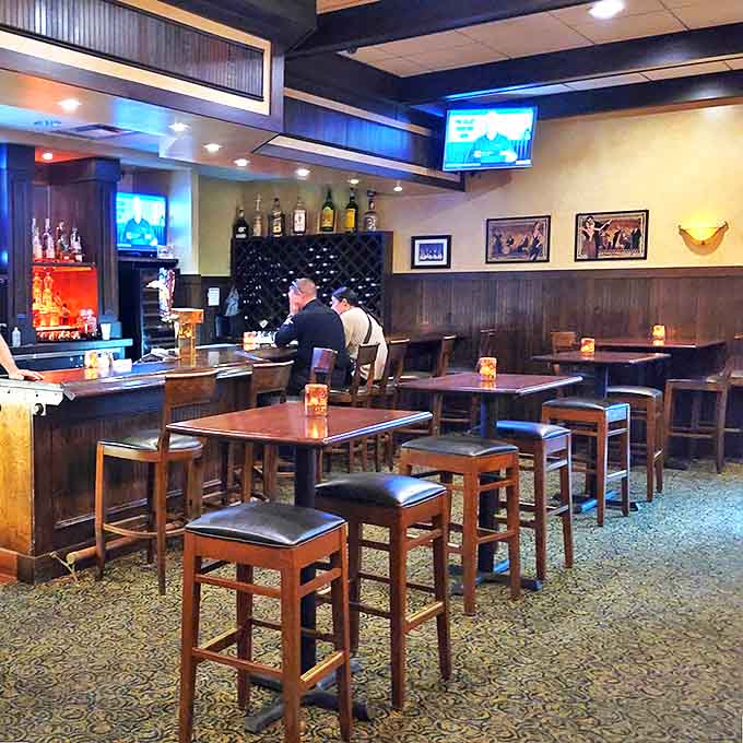 The warm, wood-paneled bar area invites patrons to linger over drinks while the tantalizing aroma of Chicken George fills the air.