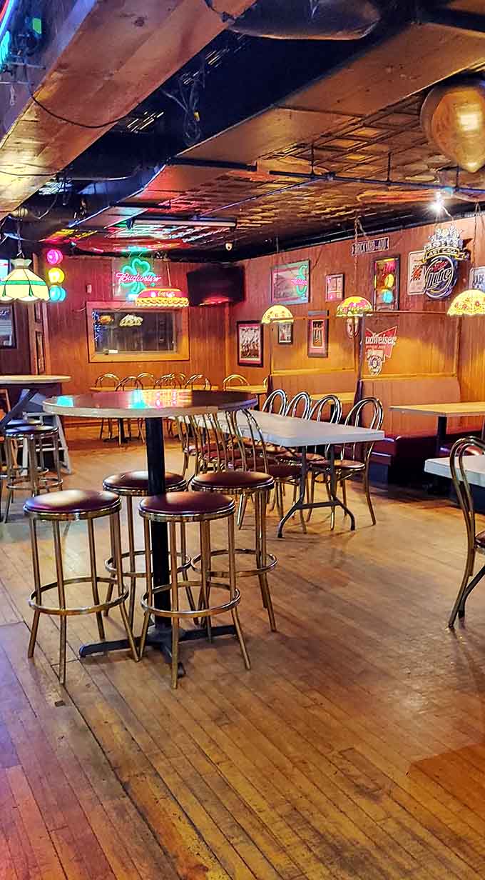 Step inside to discover the tavern's warm interior, where Tiffany-style lamps cast a golden glow over wooden tables and the classic bar.