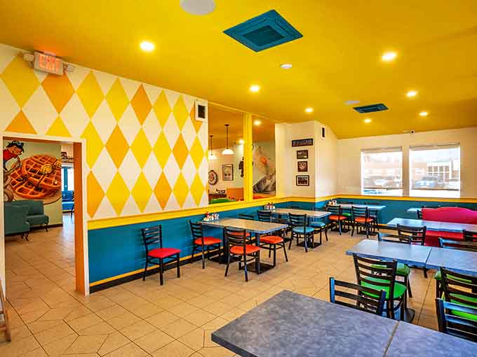 Sunshine yellow ceilings and diamond-patterned walls create a dining room that feels like stepping inside a kaleidoscope filled with pancake batter.