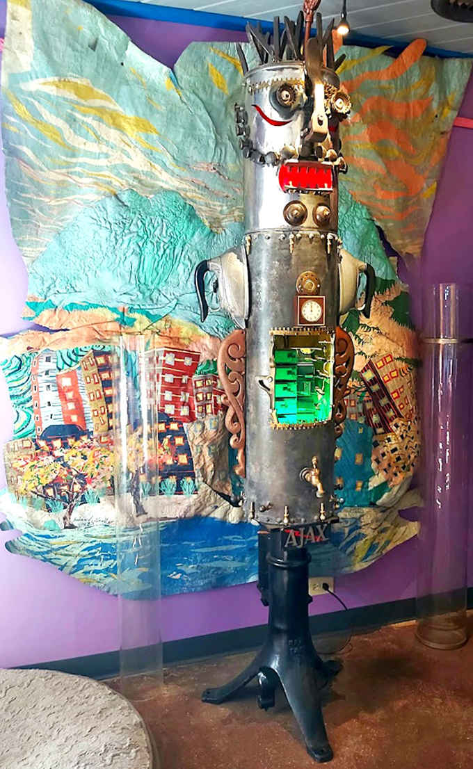 This metallic sentinel stands guard inside the gallery, a robot resurrection fashioned from what might have been kitchen appliances in a previous life.