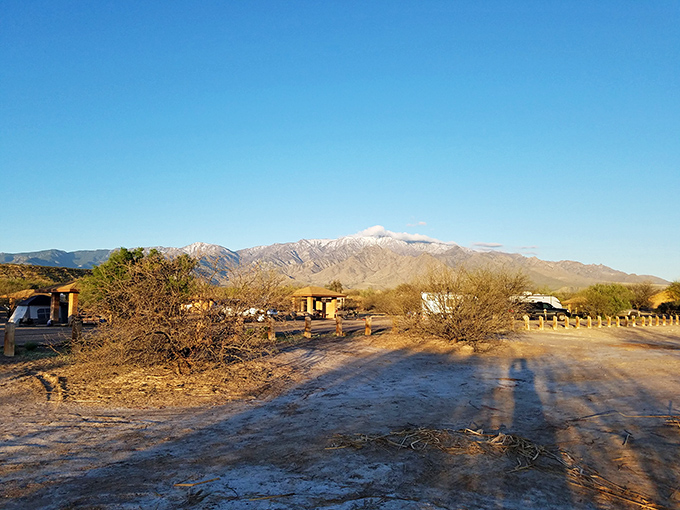 The desert meets the mountains in this breathtaking panorama, where rugged peaks rise dramatically from the valley floor like nature's own skyscrapers.