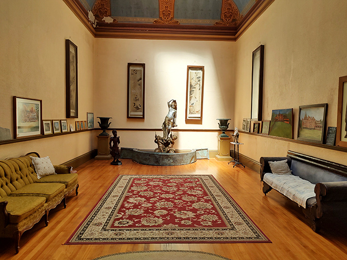 This elegant room balances Victorian opulence with surprising intimacy – where history whispers from every corner and antique furniture begs for stories.