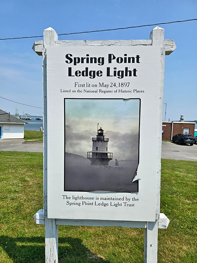 History stands tall in this weathered sign, marking Spring Point Ledge Light's 1897 origins and its place in maritime heritage.