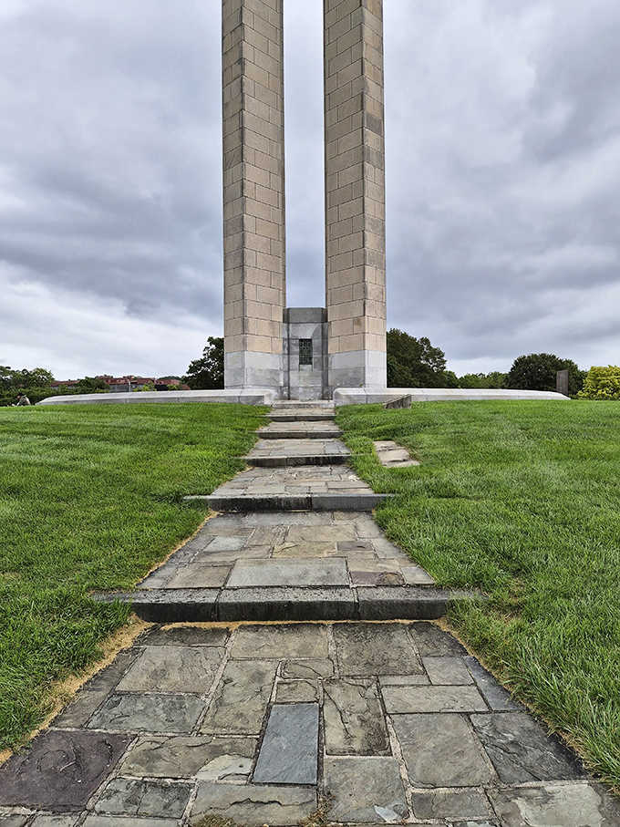 Two stone pillars rise dramatically against moody skies, creating a monumental gateway that seems to whisper, "History happened here, and it's about to happen again."