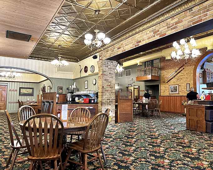 Gleaming tin ceilings and warm woodwork create the perfect backdrop for memorable meals, preserving the building's historic charm while welcoming hungry diners.