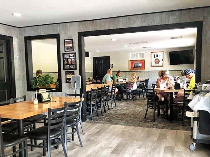 Simple wooden tables and black chairs create an unpretentious dining room where the focus remains squarely on the food and good company.