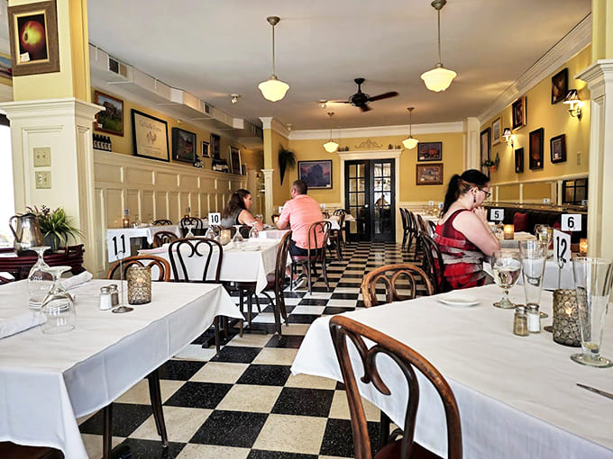 Step into a world where black and white tiles meet golden walls, creating an atmosphere that's both elegant and welcoming.