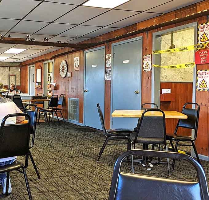 Interior: Simple tables, no-nonsense chairs, and wood-paneled walls create that authentic diner atmosphere where comfort trumps trendiness every time.