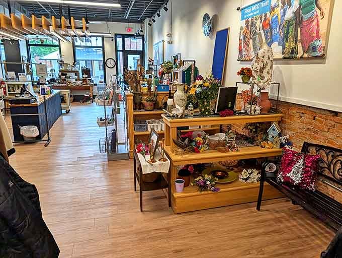 Sunlight streams through front windows, illuminating a carefully organized interior where every shelf tells a different story and every aisle promises new discoveries.