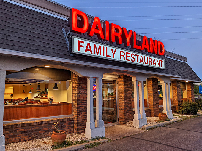Dairyland Family Restaurant's glowing sign stands out at dusk, beckoning hungry travelers with the promise of Wisconsin comfort food done right.