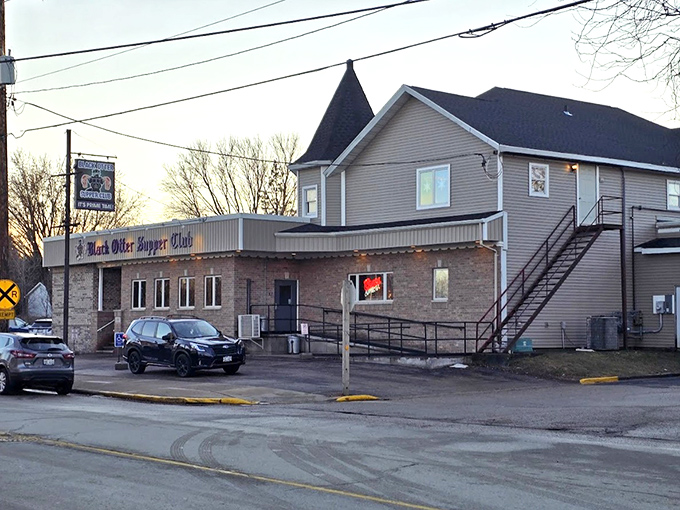 As evening approaches, Black Otter Supper Club transforms into a beacon of hospitality along the quiet Hortonville street.