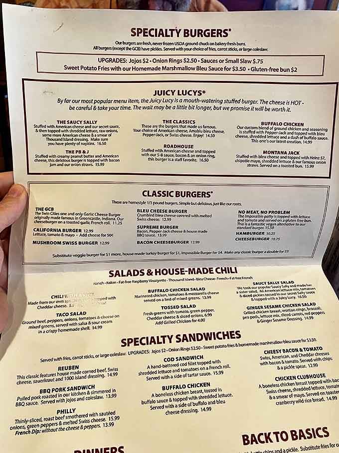 The menu reveals the star attractions &ndash; those legendary Juicy Lucys with molten cheese centers that require a warning label and patience.