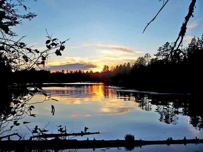 Sunset at Bear Head Lake turns the sky into a watercolor painting, proving that Mother Nature has better artistic skills than any Instagram filter ever will.