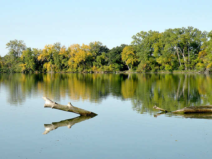 Mirror-like waters reflect autumn's palette&mdash;nature showing off its own masterpiece without a hint of modesty.