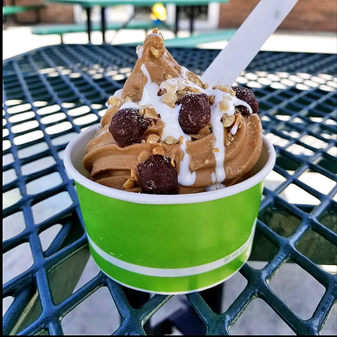 Chocolate swirls reaching toward heaven, topped with cookie chunks and drizzle – architecture you can eat with a spoon.