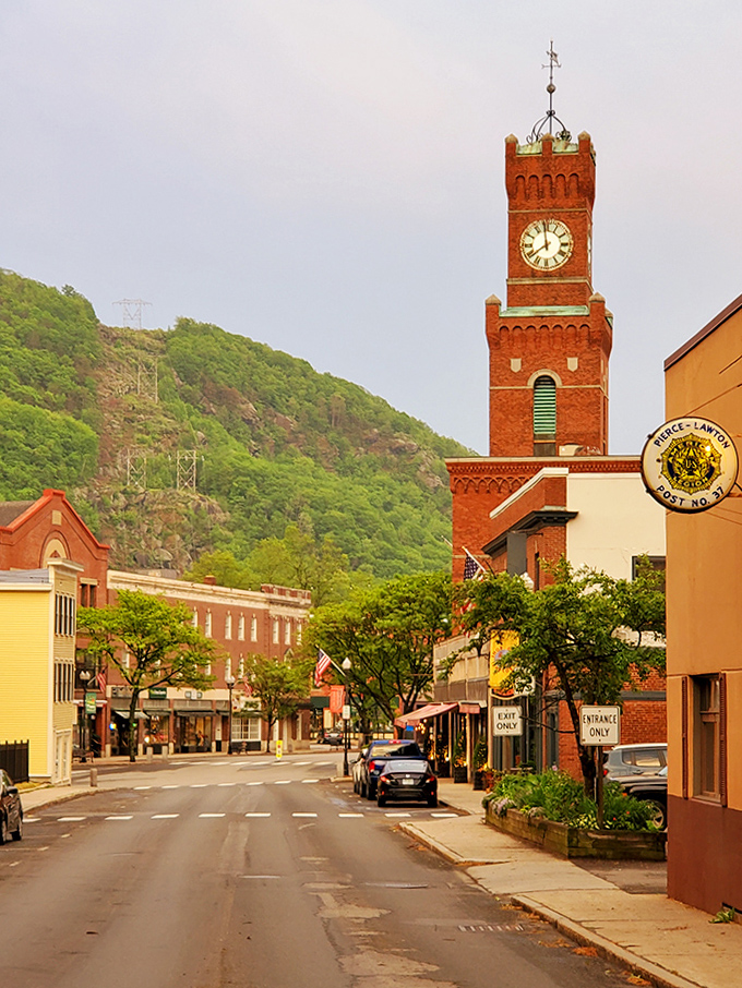 The clock tower stands sentinel over streets lined with shops where owners know your name and your coffee order.