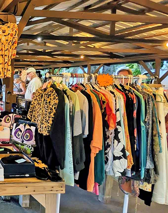 Rainbow rows of garments where vintage gems hide between everyday items. Fashion archaeologists could spend hours excavating these racks for buried treasure.