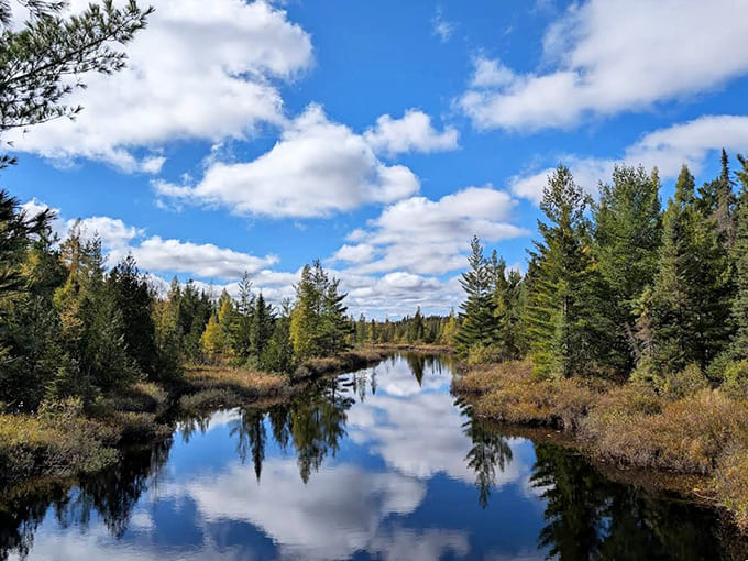 Mirror-perfect reflections turn the lake into nature's own Rorschach test, where every glance reveals something new in the interplay of water and sky.