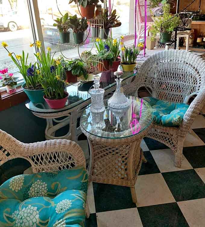 White wicker furniture with tropical cushions creates the perfect spot to contemplate whether you need another chair, and the answer is always yes.