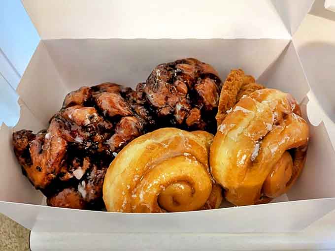 Behold the holy grail of breakfast pastries &ndash; apple fritters with their caramelized edges alongside cinnamon rolls that could make a grown adult weep.