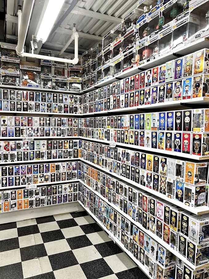 The Funko Pop wall stands like a colorful army of big-headed sentinels, guarding treasures from every imaginable pop culture universe.
