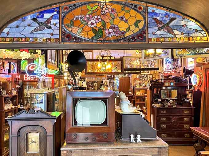 Step inside and prepare for sensory overload, where stained glass, neon signs, and decades of collectibles compete for your attention.