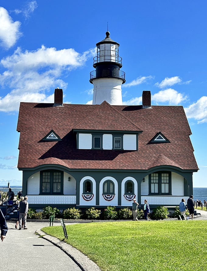 Under clear blue skies, Portland Head Light's pristine white tower pops against the landscape like a maritime exclamation point announcing "You've arrived in Maine!"