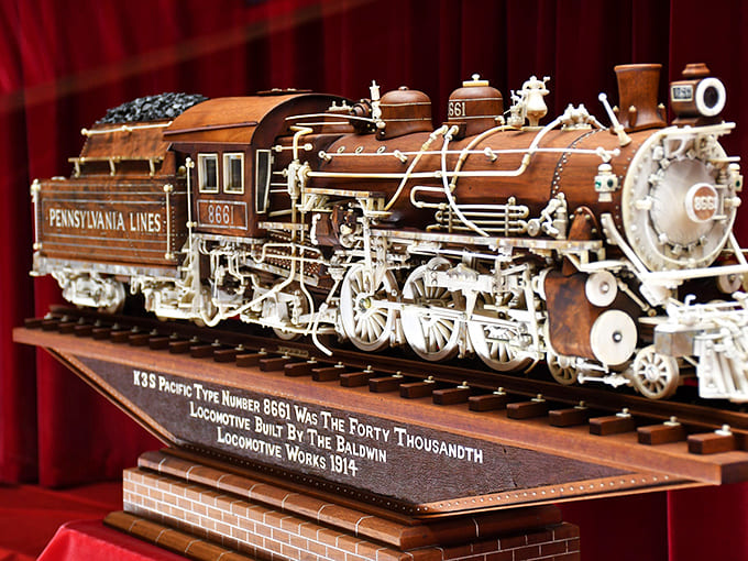 This intricate wooden locomotive model showcases the breathtaking precision of Ernest Warther's legendary carving skills.