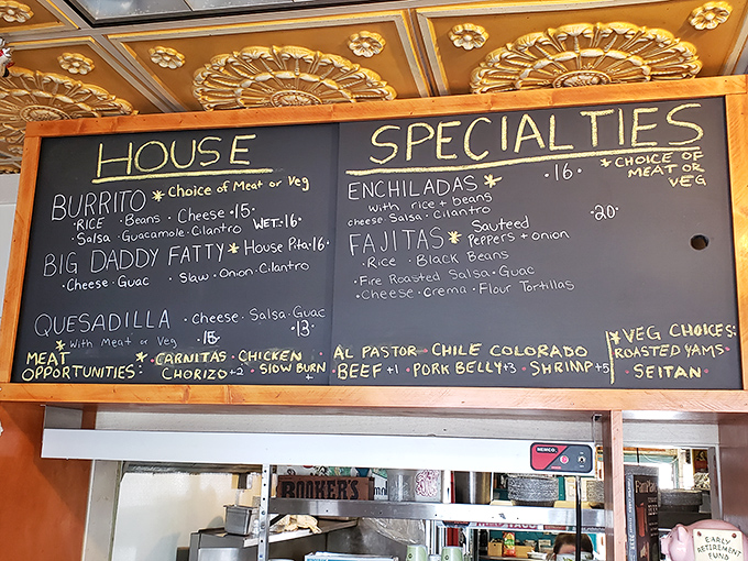 The chalkboard menu reads like a carnivore's dream journal, with options that will haunt your food fantasies for weeks to come.