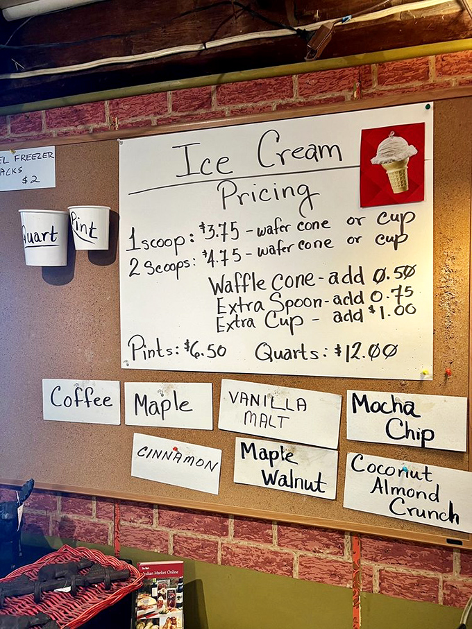 The handwritten ice cream menu board showcases flavors from classic vanilla to Vermont maple walnut. No digital displays here &ndash; just chalk and charm.