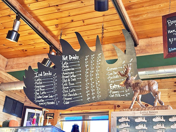 The moose-shaped menu board showcases an impressive array of drinks, from classic espresso to signature North Shore specialties.