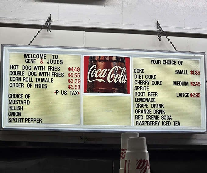 The menu board speaks volumes in its simplicity: hot dogs, fries, tamales. No distractions, just focused excellence that's stood the test of time.