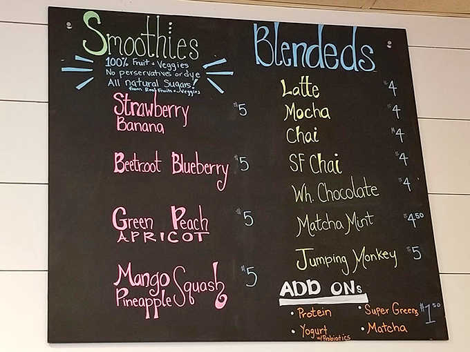 Decisions, decisions! The vibrant chalk menu showcases smoothie creations that turn fruits and veggies into liquid masterpieces.