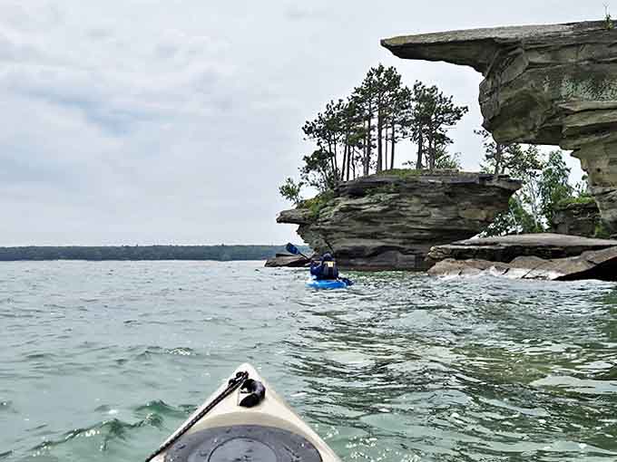 The journey from Port Austin reveals dramatic shoreline scenery, where each bend offers new perspectives of Michigan's most photogenic geological formations.