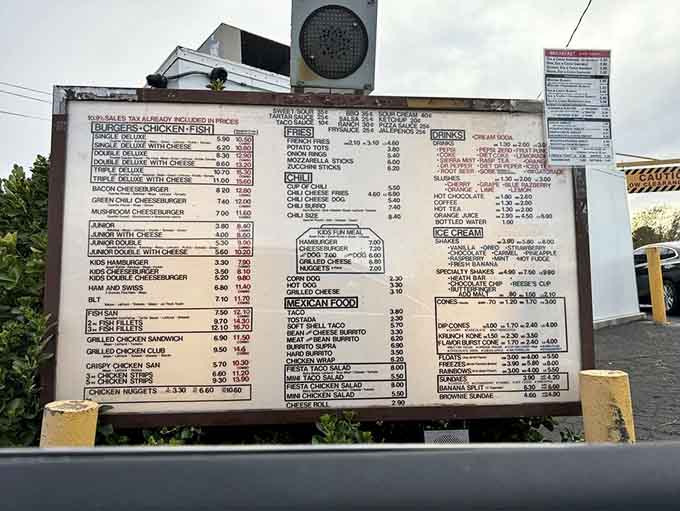 The menu board displays an impressive array of options, though let's be honest, you're here for that legendary Green Chile Cheeseburger.