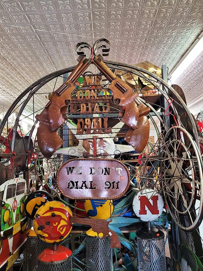 Inside Red's, the tin ceiling watches over a kingdom where metal art reigns supreme and every corner hides another delightful discovery.