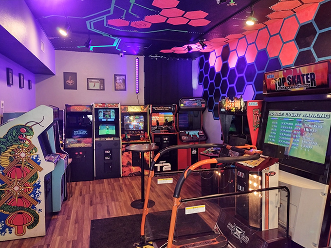 The retro arcade corner whispers promises of high scores and cramped hands, where Pac-Man still hungrily awaits your quarters.