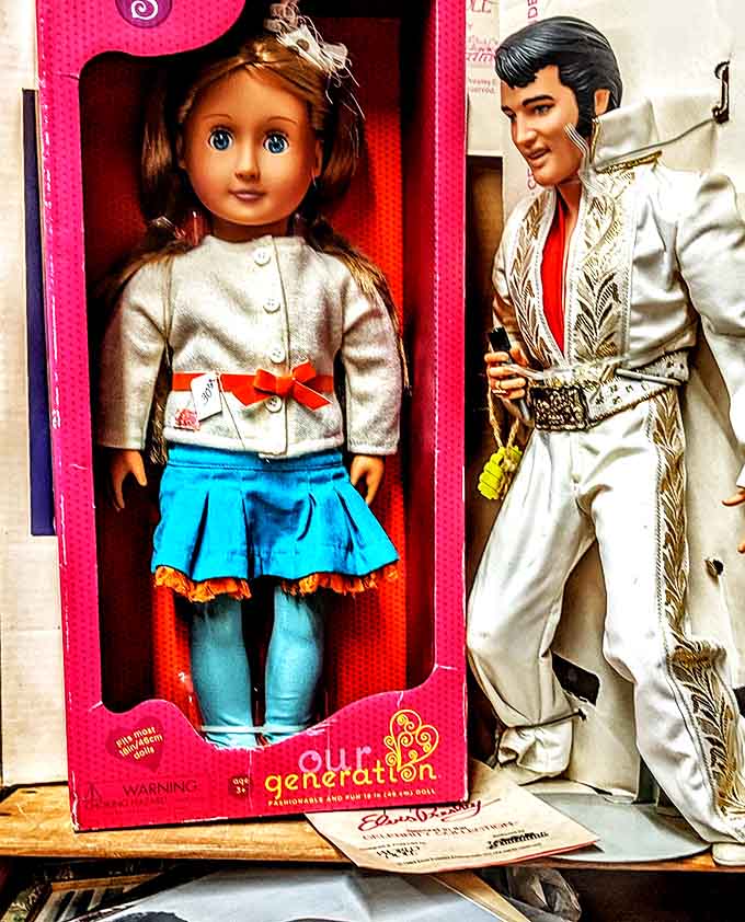 A pristine "Our Generation" doll shares shelf space with a white-suited Elvis figurine, bridging generations of childhood icons in one nostalgic display.