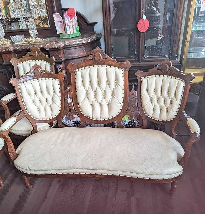 This Victorian settee isn't just furniture &ndash; it's a time machine with upholstery, whispering tales of parlor gossip from another century.