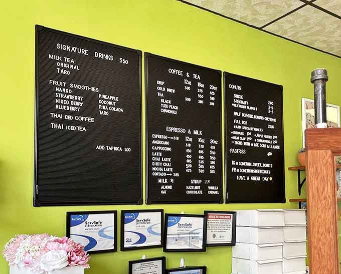 The menu board tempts with options from classic donuts to Thai iced coffee, each item promising a unique flavor adventure.