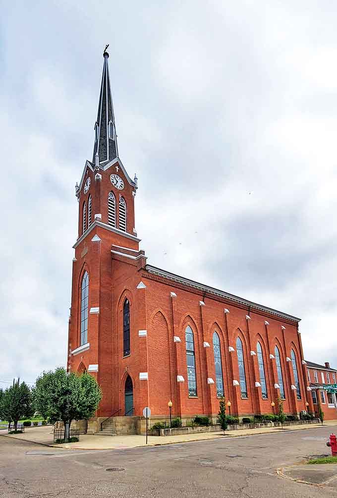 St. Mary's Catholic Church stands as a red-brick testament to faith and craftsmanship, its soaring spire visible throughout town like an architectural exclamation point.