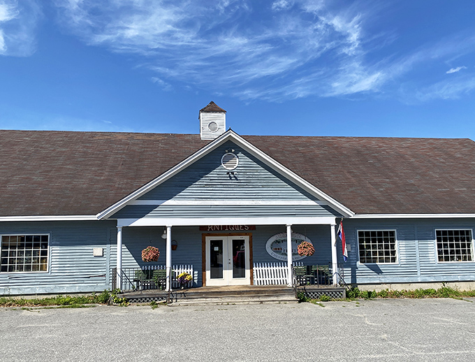 The blue-painted community center welcomes visitors with classic New England understatement and practical charm.