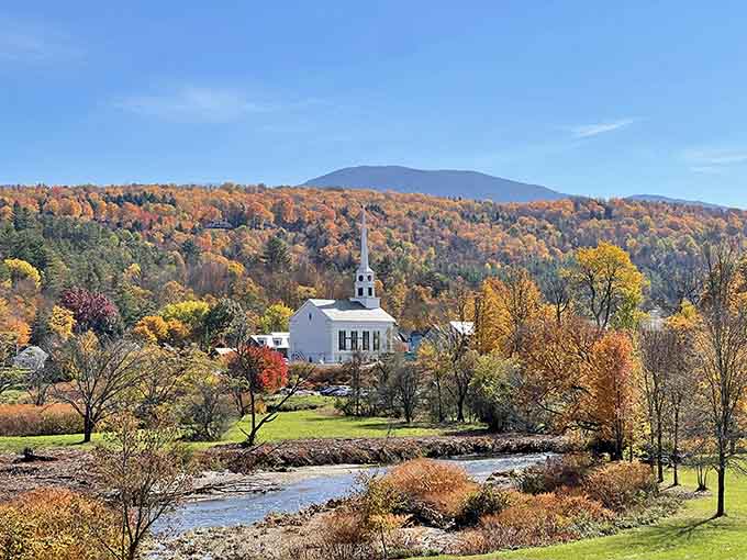 That white steeple against autumn colors hits different, like a postcard that somehow became three-dimensional and invited you in.
