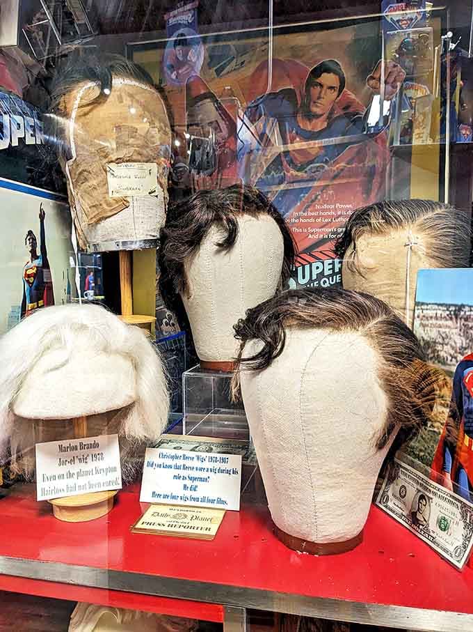 These wigs from Superman films prove that even the Man of Steel needed hair and makeup help, displayed on mannequin heads that look slightly concerned about their styling choices.