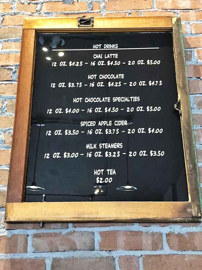 The handwritten menu board showcases a tempting array of hot beverages &ndash; each promising a moment of liquid comfort in a hectic world.