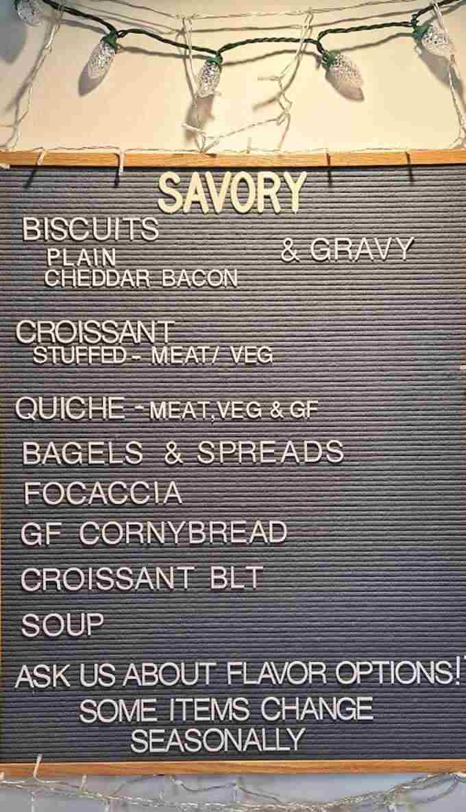 A letterboard menu that reads like poetry to carb enthusiasts &ndash; savory biscuits, stuffed croissants, and quiche that would make a French grandmother weep with joy.